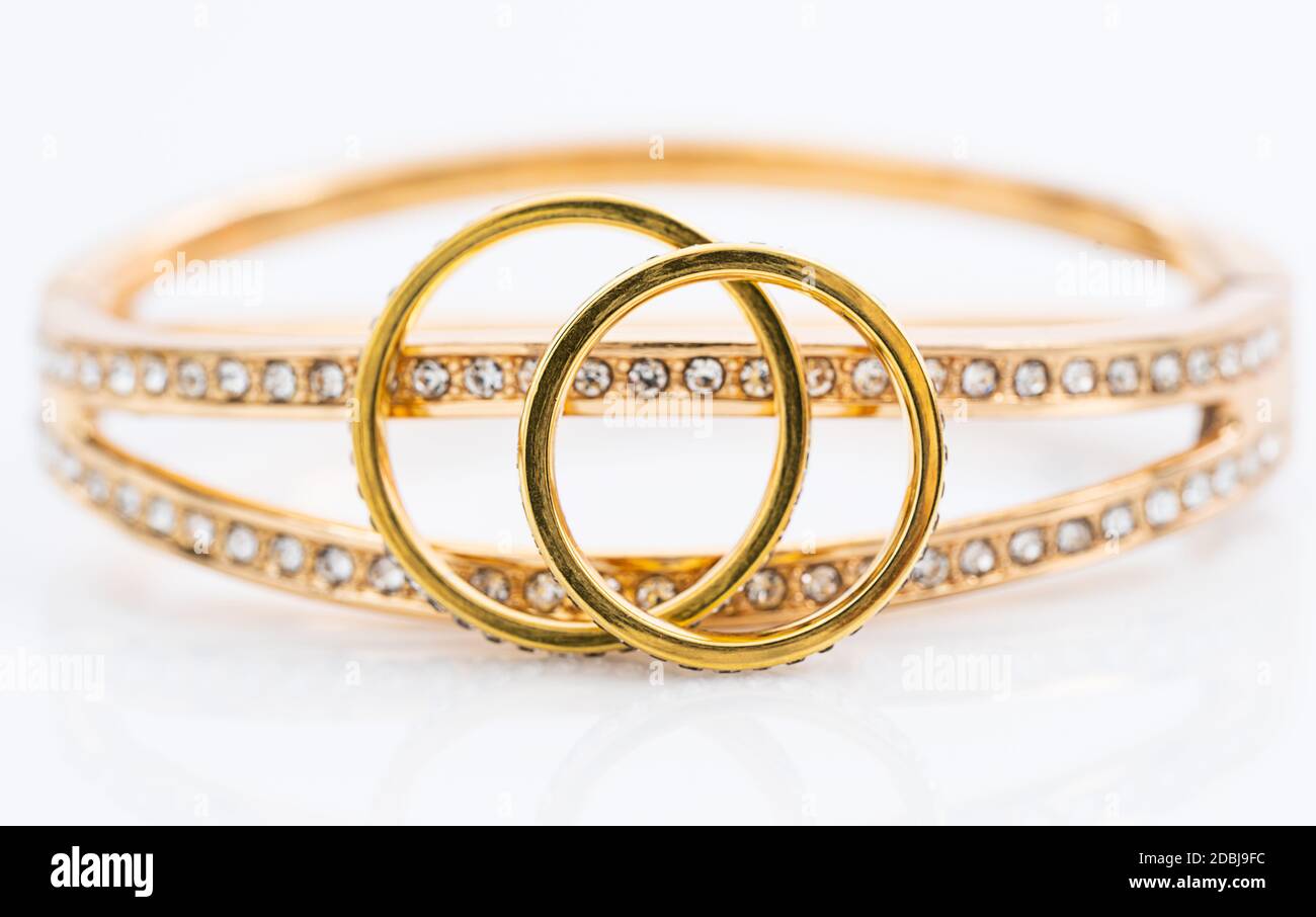 Closeup Gold ring diamond gem. Gold wedding rings with diamond on white ...