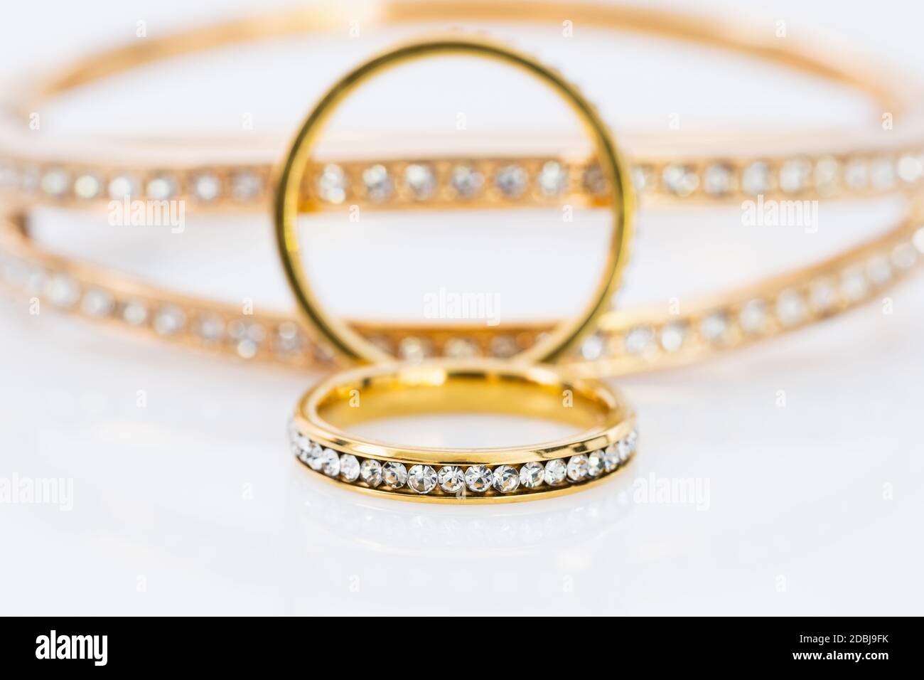 Closeup Gold ring diamond gem. Gold wedding rings with diamond on white ...