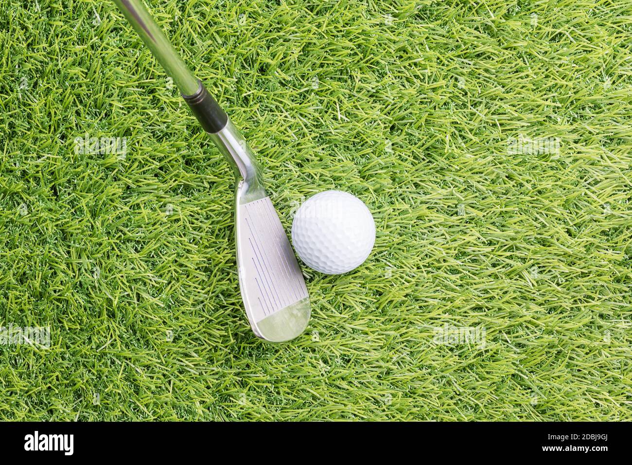 Golf ball before hitting with golf club on course Stock Photo - Alamy