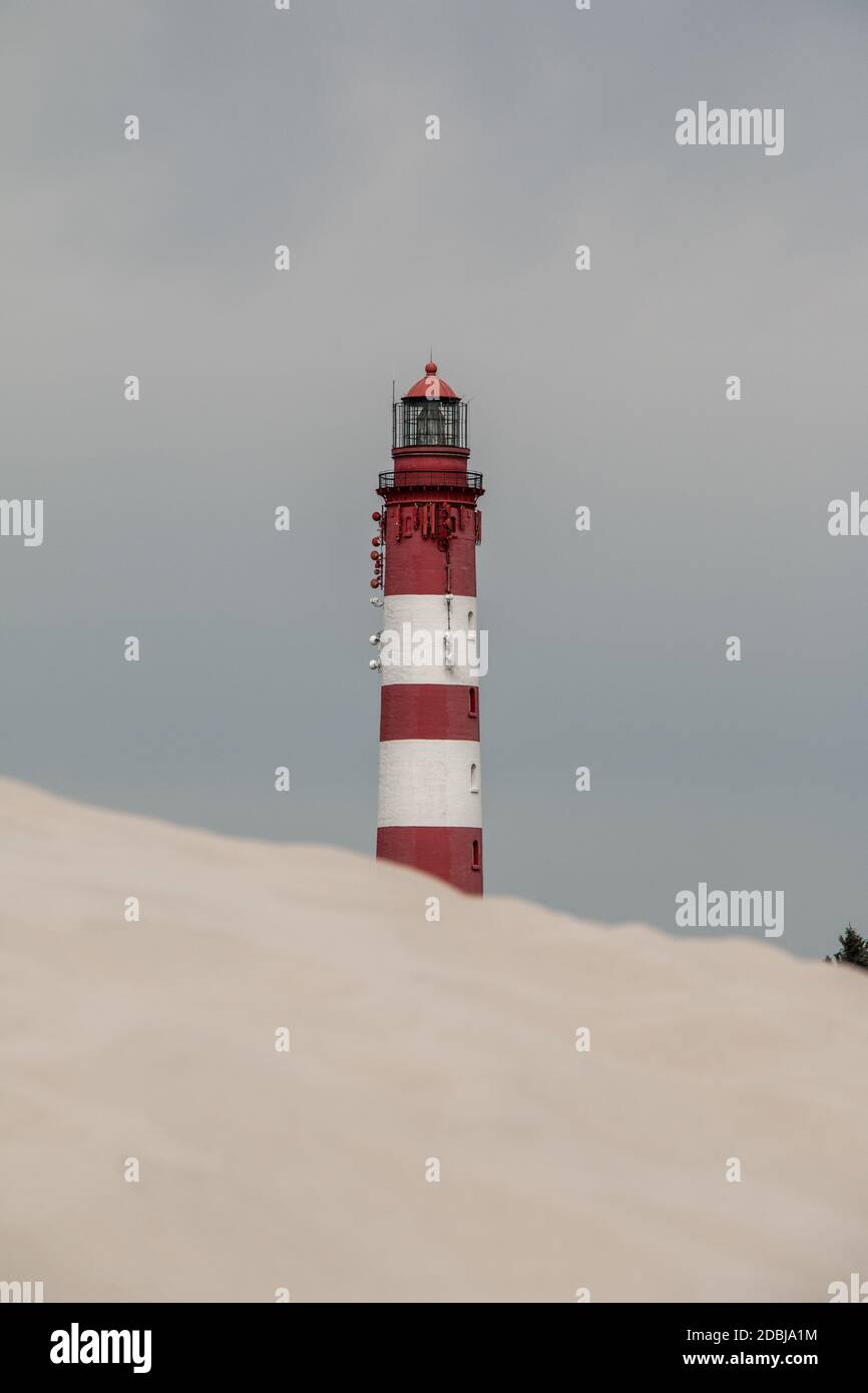 The Amrum lighthouse behind a dune Stock Photo - Alamy