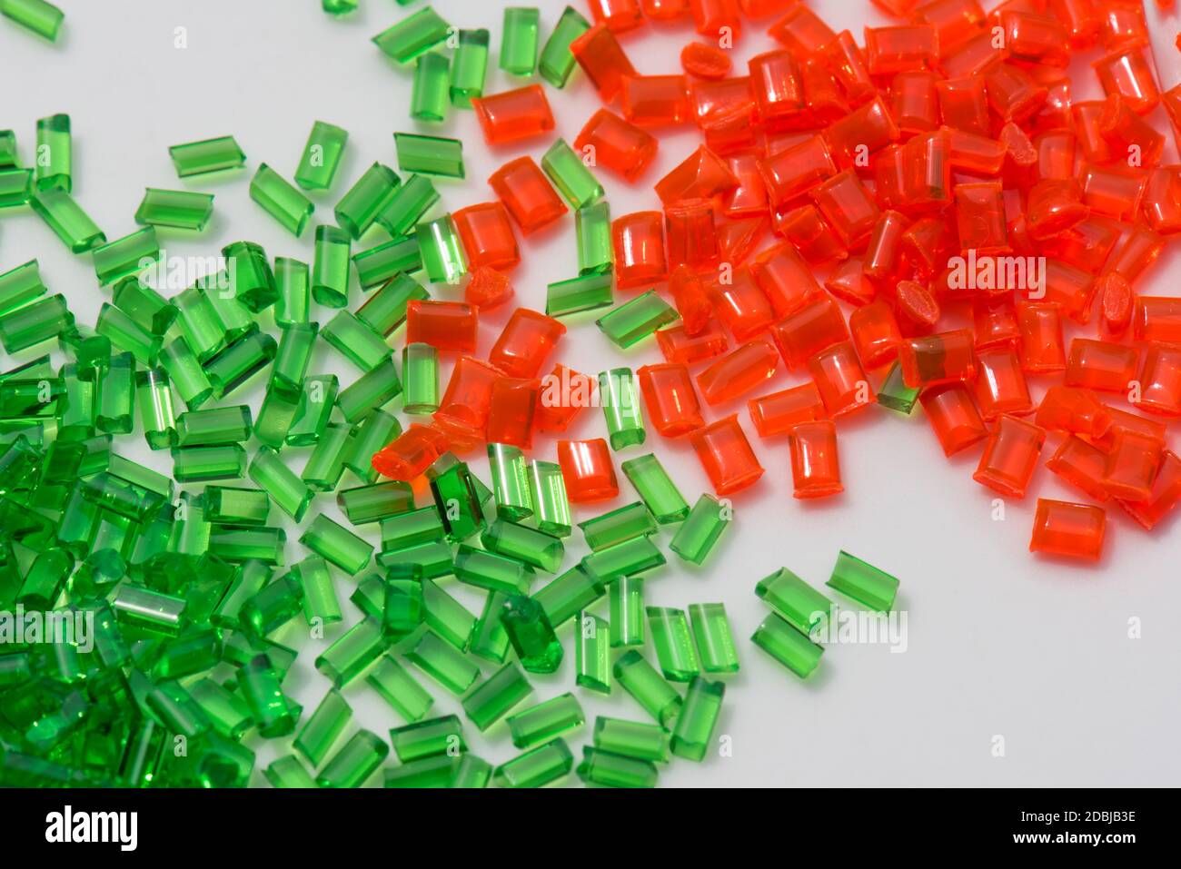 red and green transparent polymer granulate on white background Stock ...