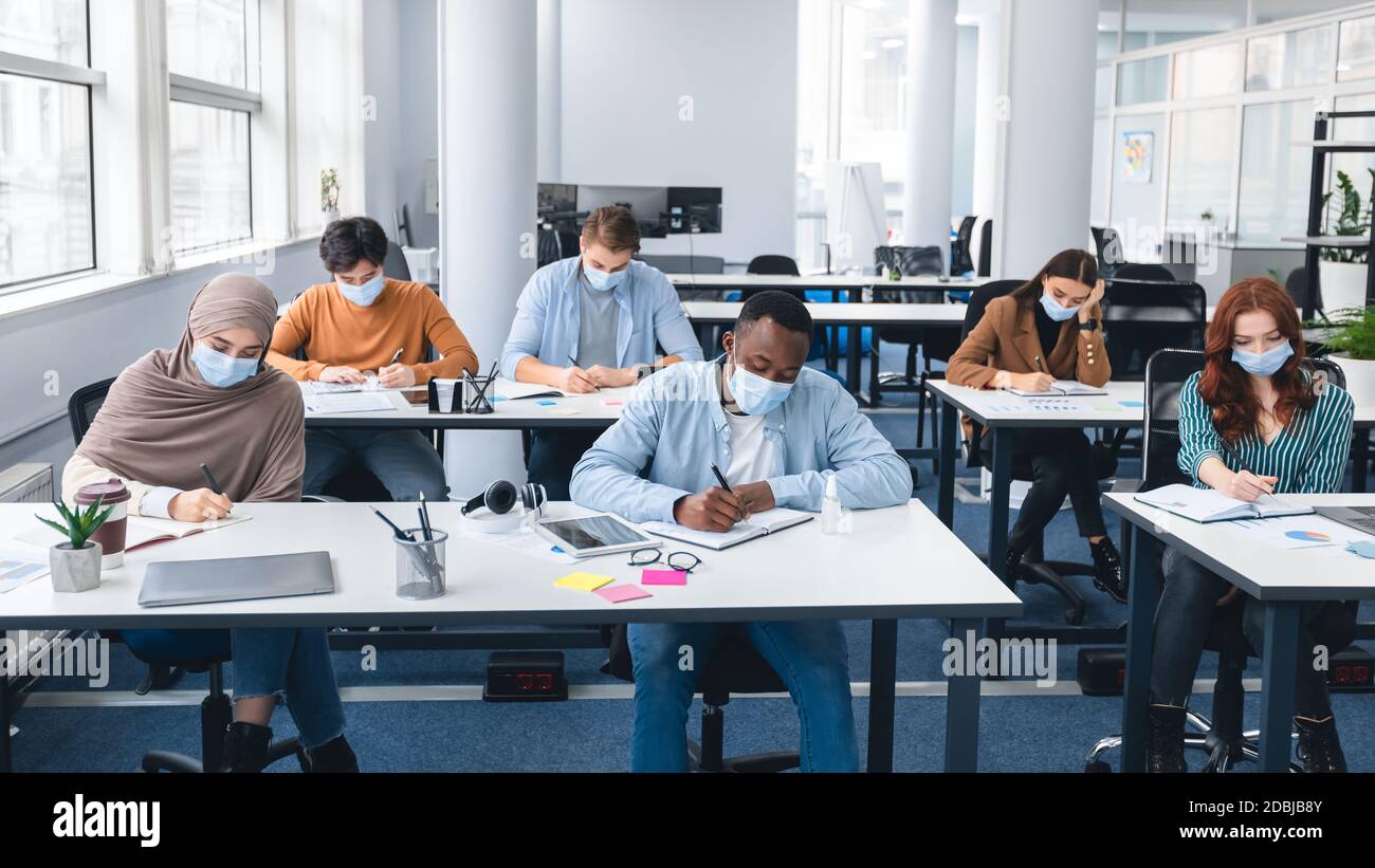 Diverse group of international students studying in classroom Stock ...