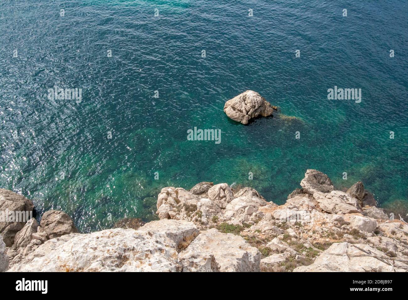 Rock in the sea, Ibiza, Spain Stock Photo - Alamy