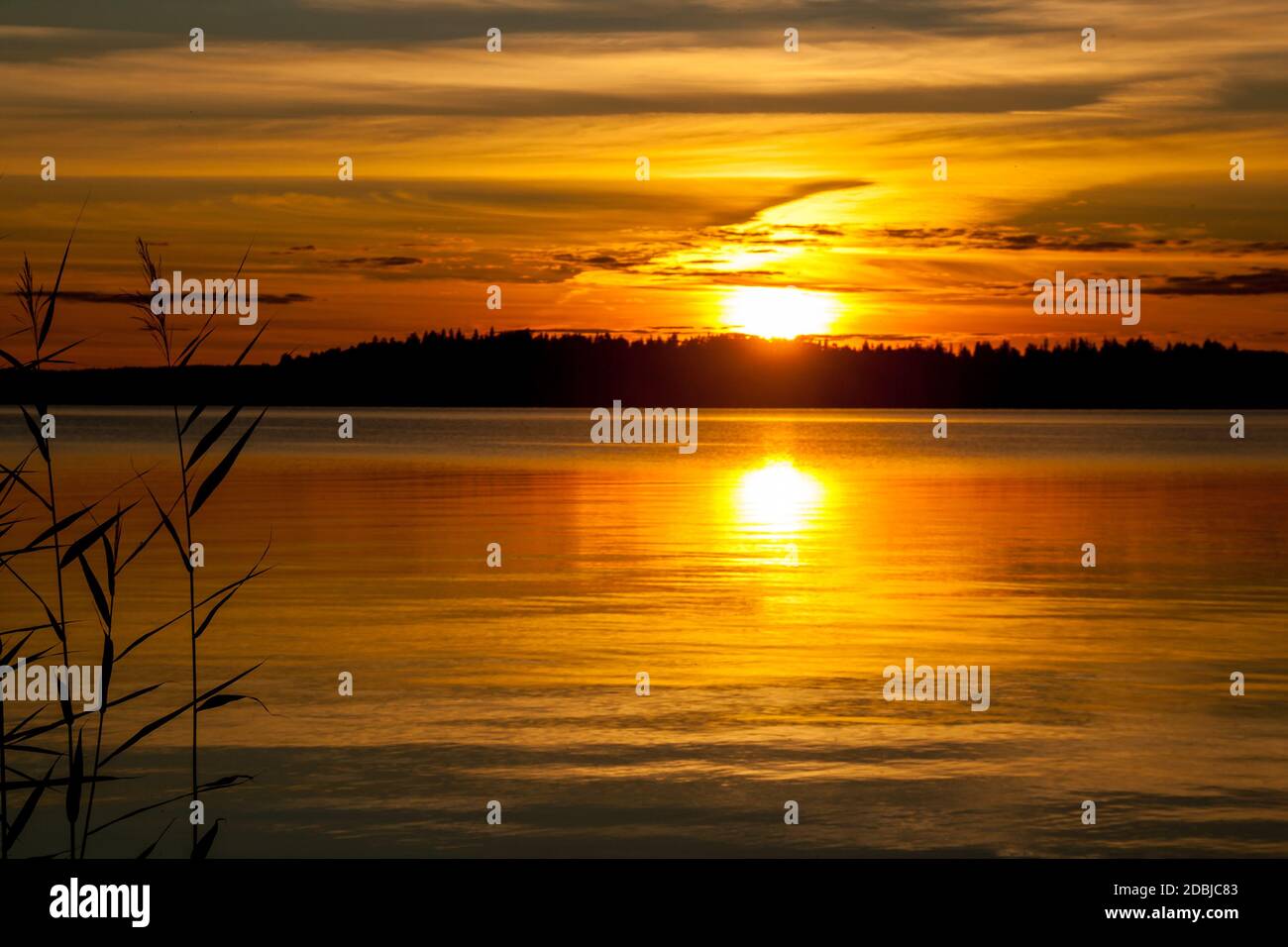 Sunset at the lake Unden Stock Photo - Alamy