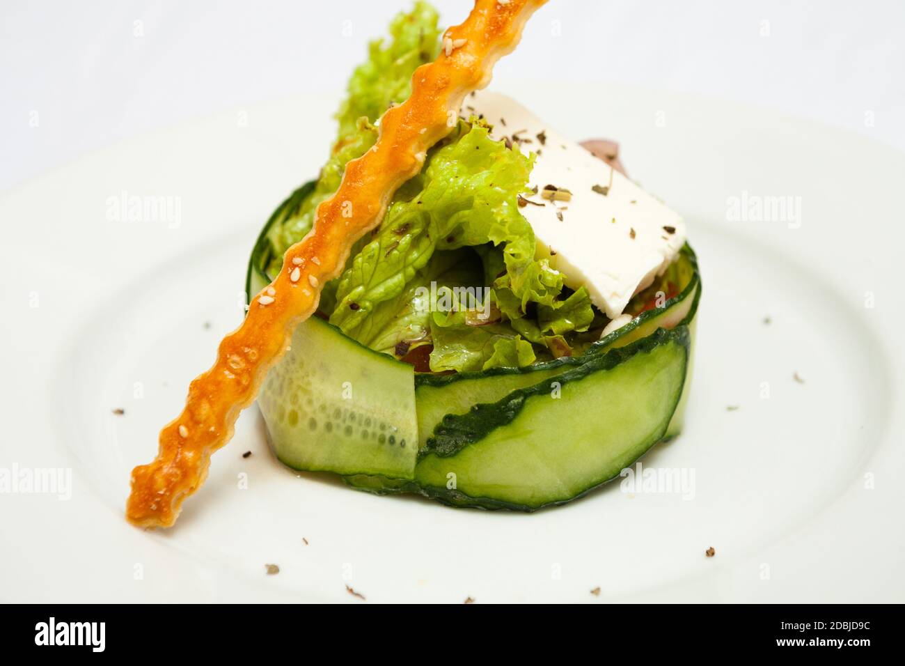 Salad with crab sticks, sweet corn, cucumbers, boiled eggs, onion and ...