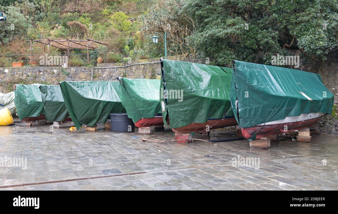 Boats Covered With Tarp Packed For Winter Safety Stock Photo - Alamy