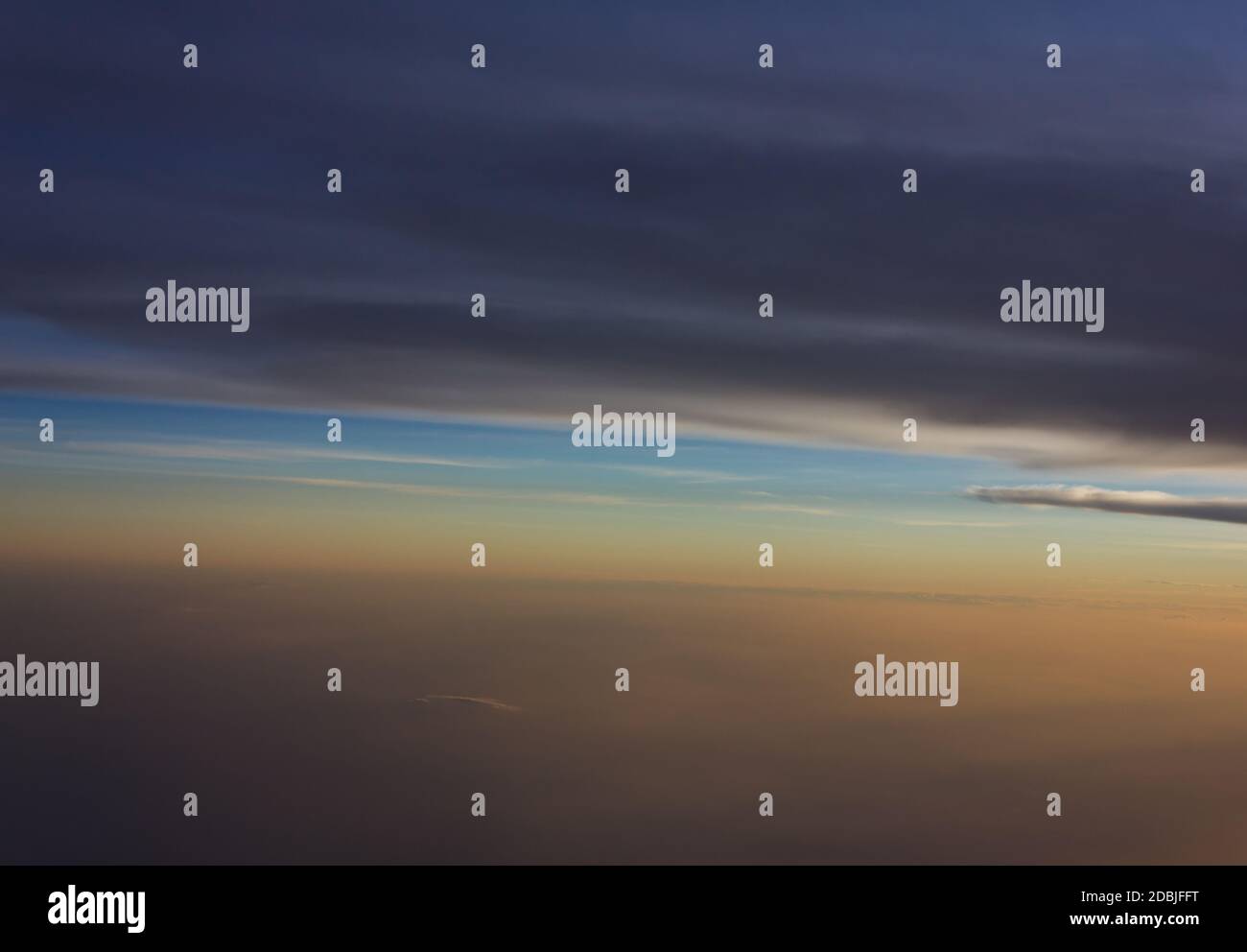 Sky and clouds at sunset bird's eye view on the plane Stock Photo - Alamy