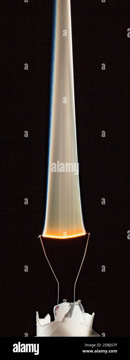 An electrical element in a light bulb igniting and burning out Stock ...