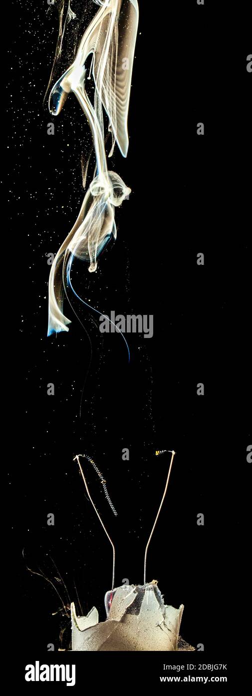 An electrical element in a light bulb igniting and burning out Stock ...