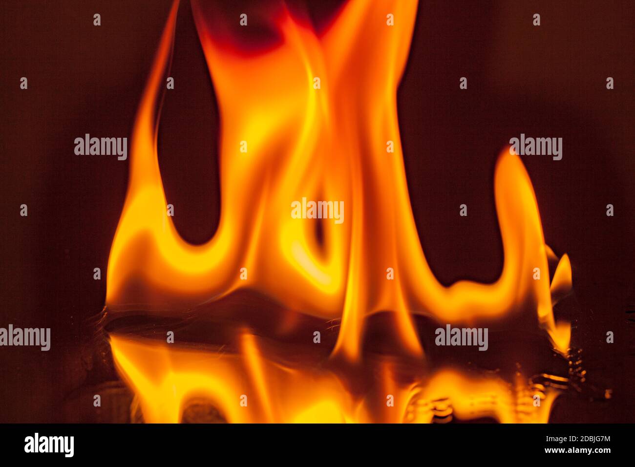 Open flame with reflection on black glass Stock Photo - Alamy