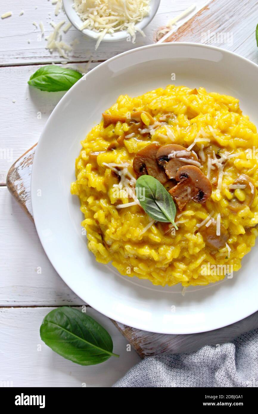 Traditional Italian risotto with mushrooms, saffron and parmesan cheese ...