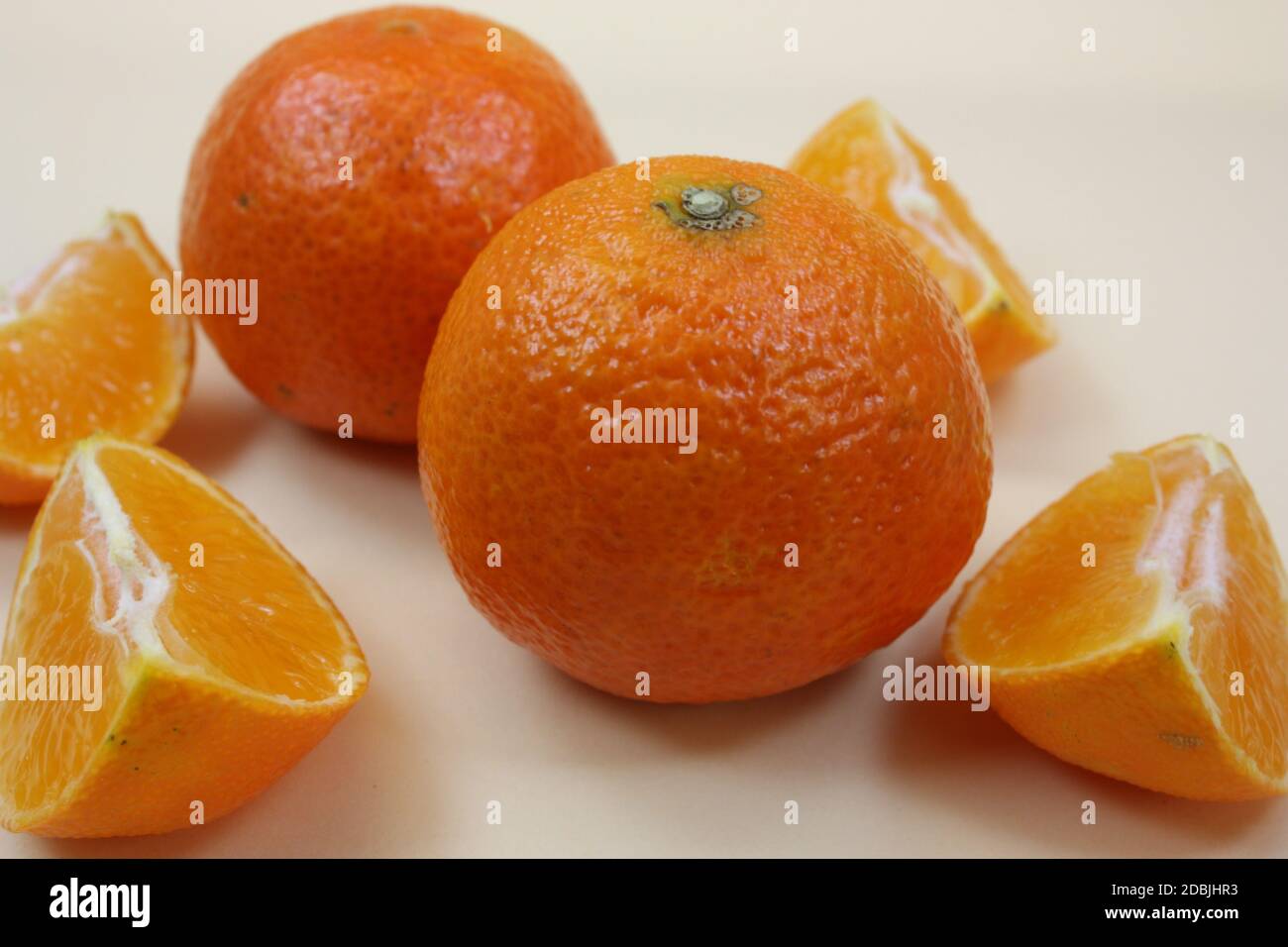 Peeled and split oranges Stock Photo - Alamy