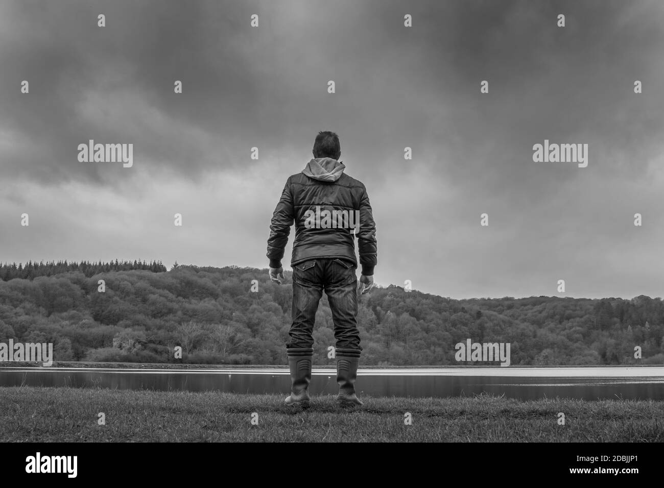 One man standing from behind Black and White Stock Photos & Images - Alamy