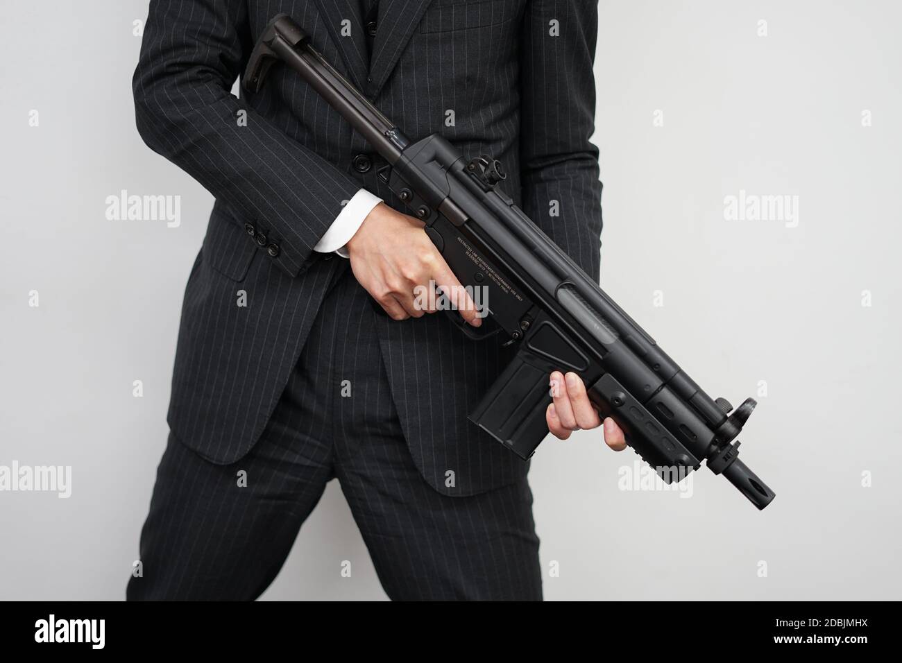 Businessman to fight with a machine gun. Shooting Location: Tokyo ...