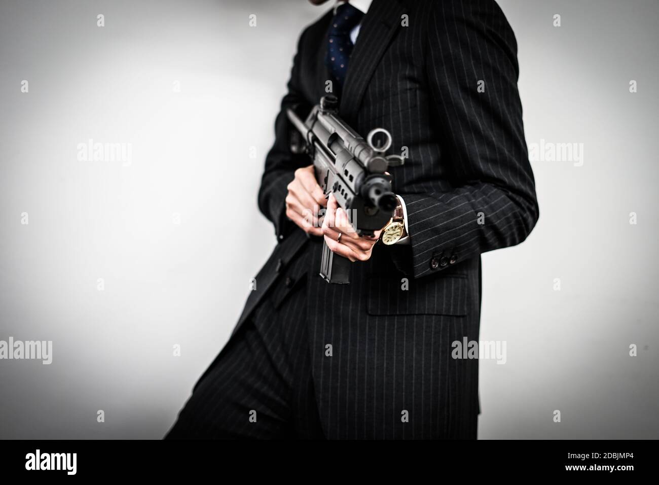 Businessman to fight with a machine gun. Shooting Location: Tokyo ...
