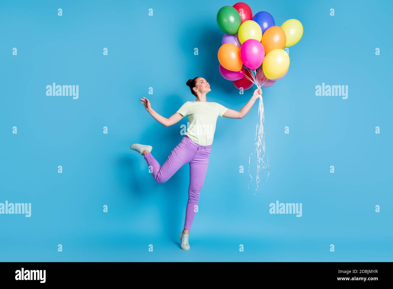 Full length body size photo of girl keeping pile of colorful air ...