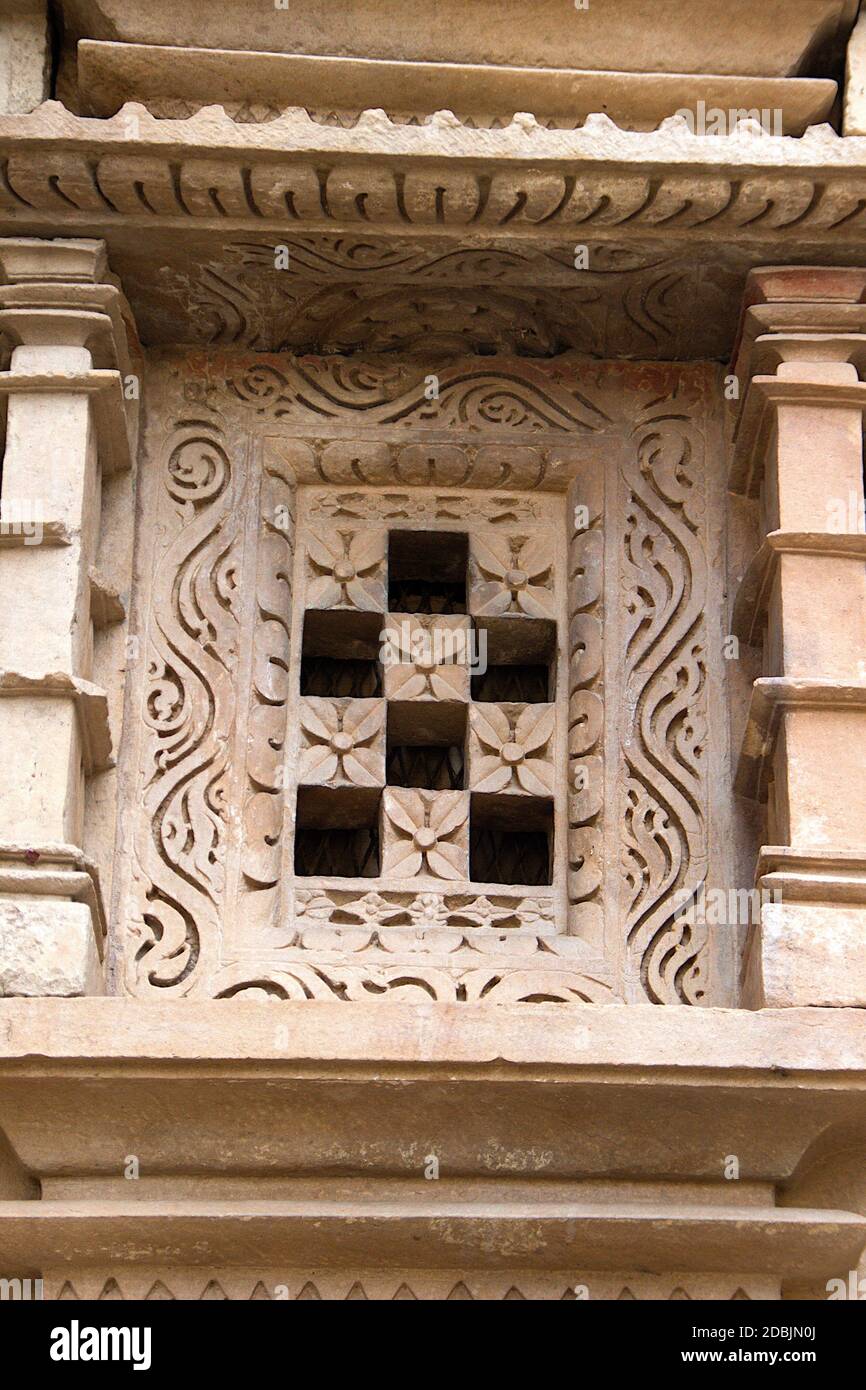 Floral design and square holes of stone window frame at Jain Temple in ...