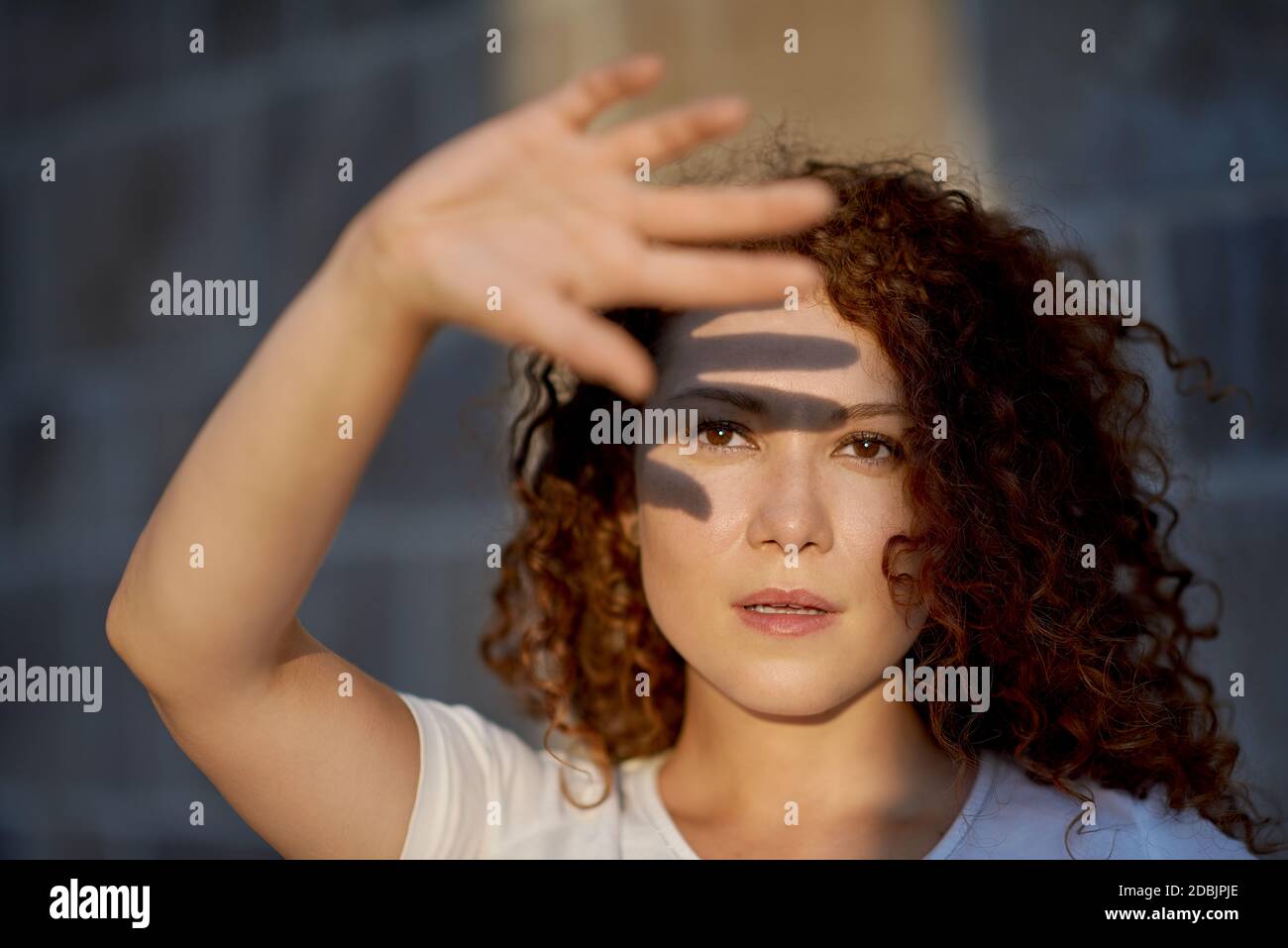 Red head Woman looking ahead, shadows on her face Stock Photo - Alamy