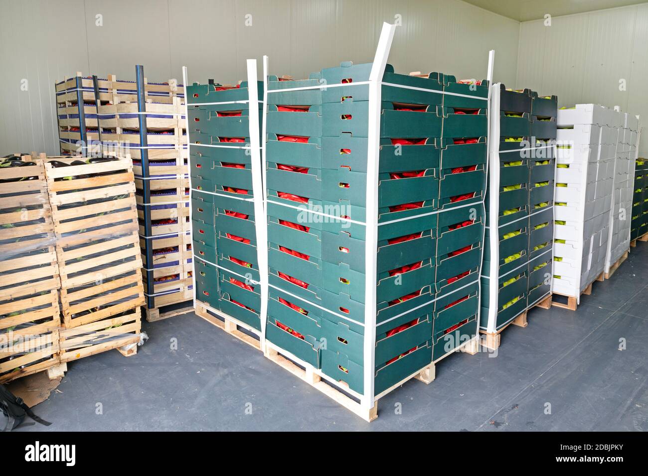 Crates of Produce at Pallets in Storage Warehouse Stock Photo - Alamy