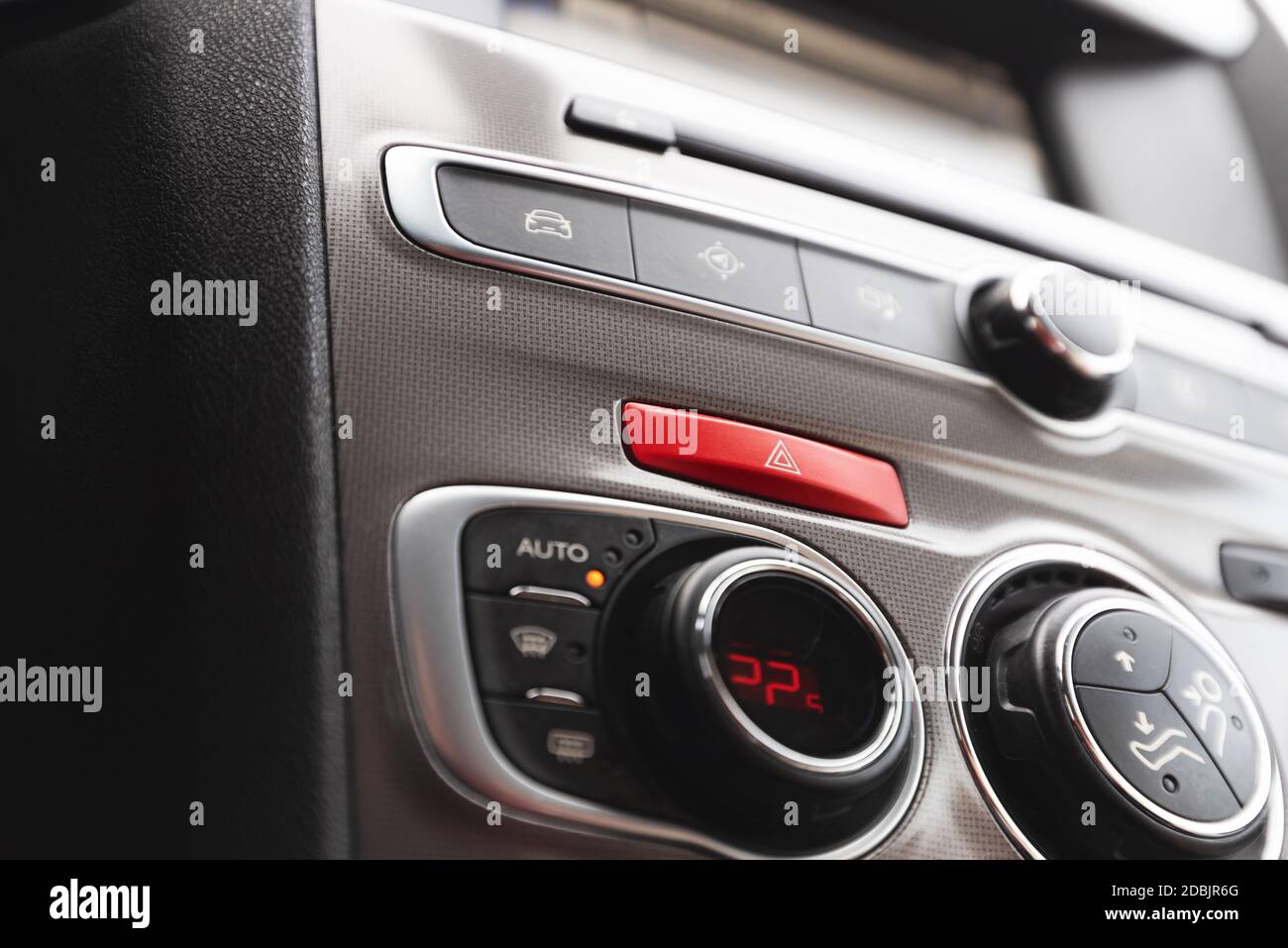Emergency warning button on the instrument panel in a modern car Stock ...