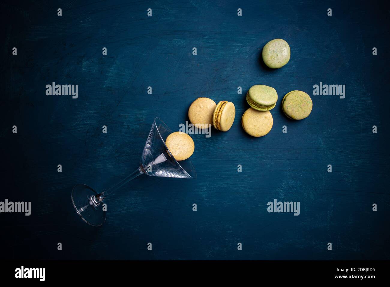 Studio shot photo of spilled macarons from martini glass, top view ...