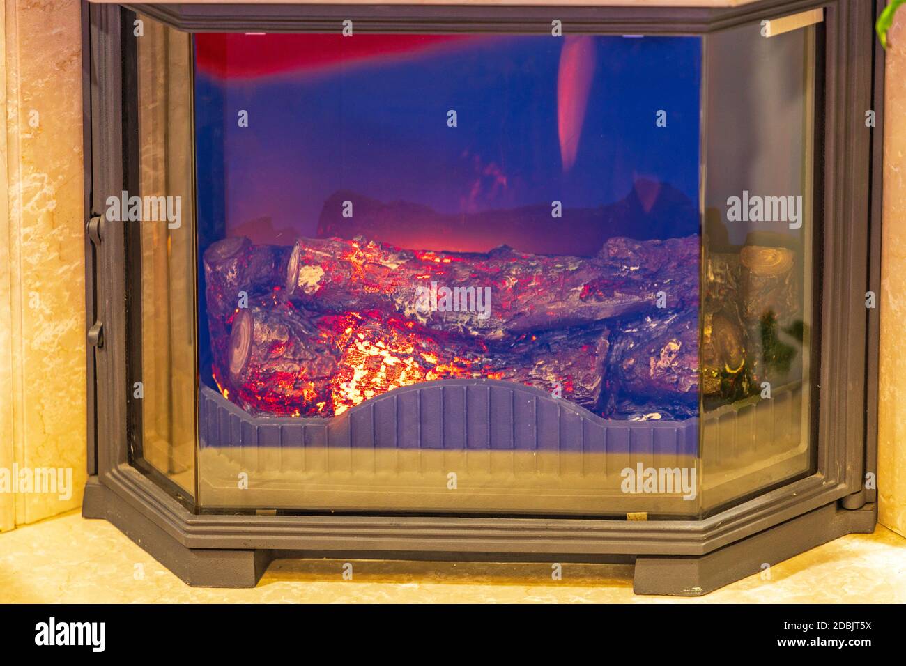 Electric Fireplace With Ceramic Wood Logs Fire Effects Stock Photo - Alamy