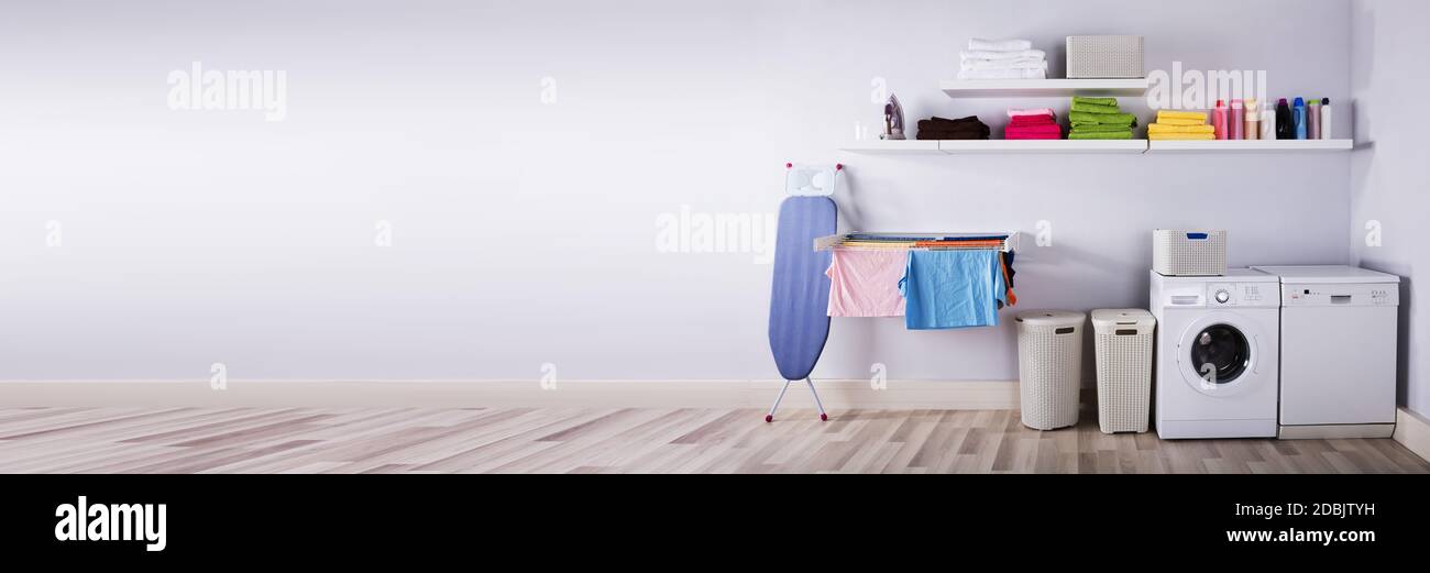 Utility Laundry Room Wall With Washing Machine Stock Photo - Alamy