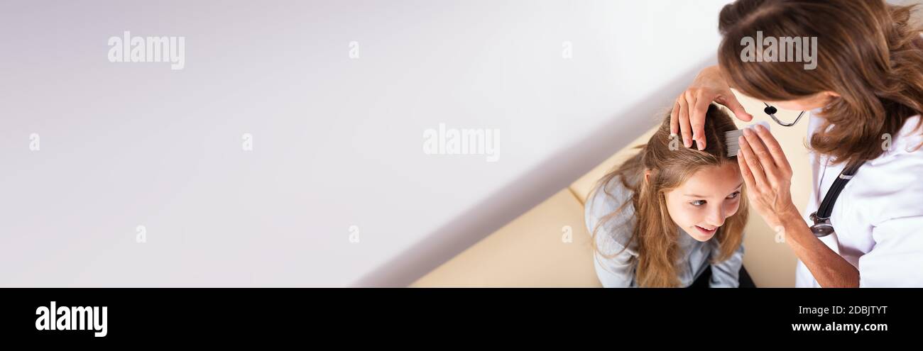 Doctor Checking Child Head Hair After Lice Treatment Stock Photo - Alamy