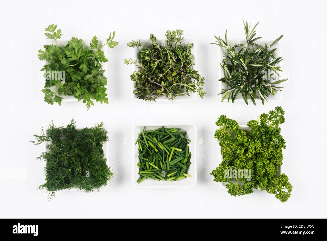 Different fresh green herbs and spices for seasoning are in dish on ...