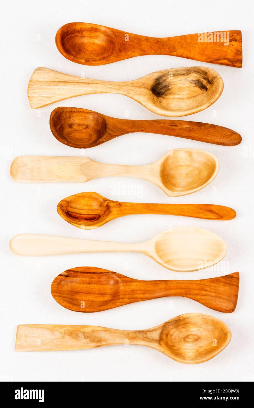 Different unique handmade wooden spoons on white background, wood ...