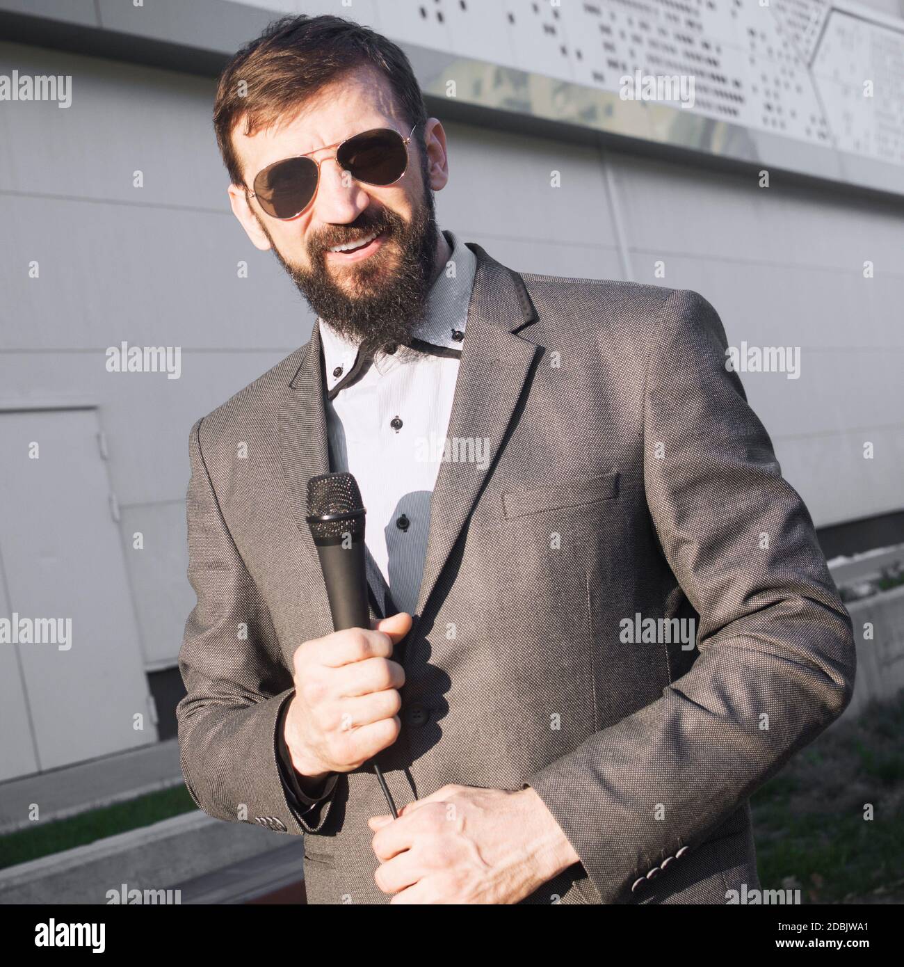 Commentator talking speaking into microphone hi-res stock photography ...