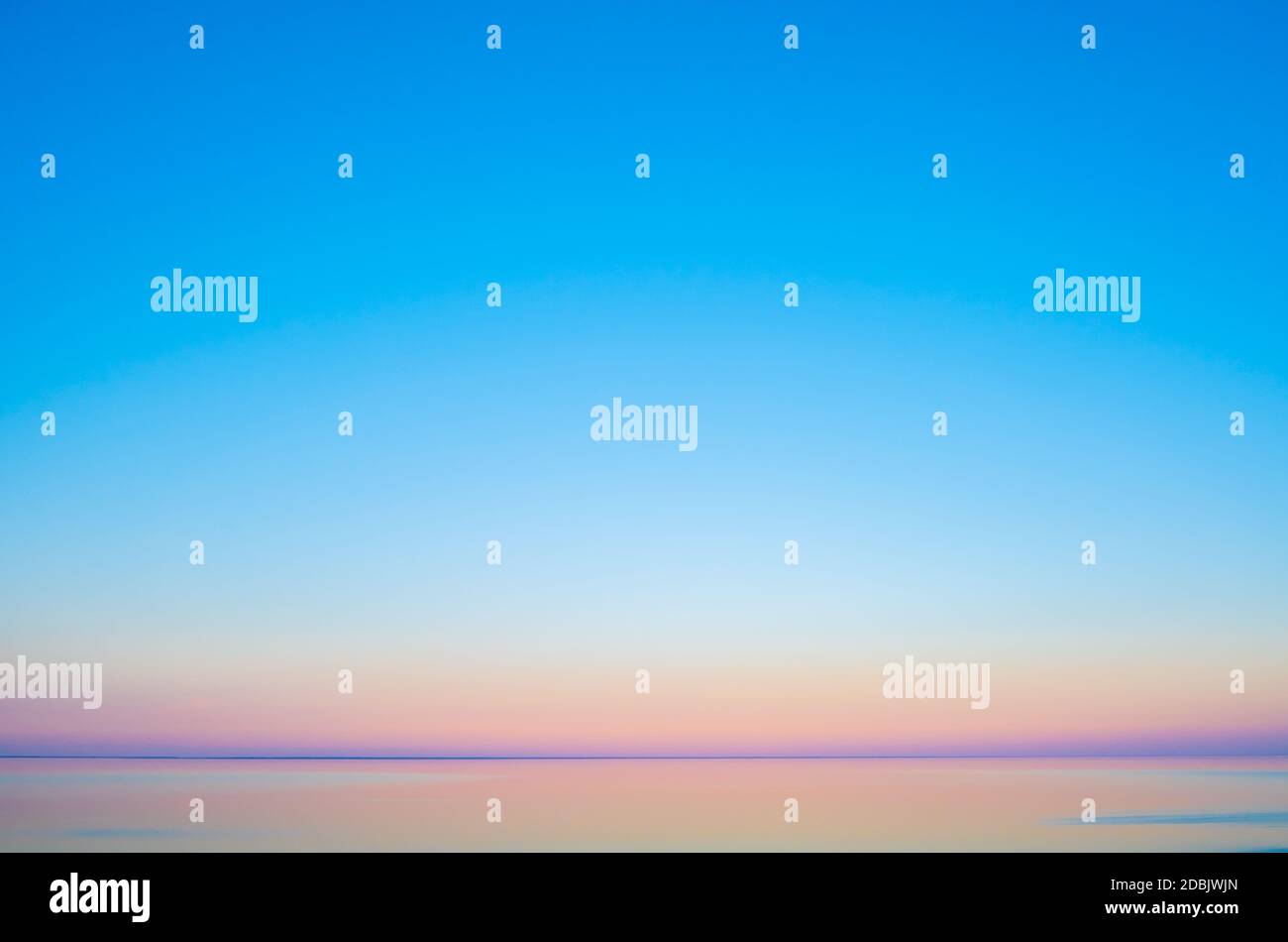 Cloudless sunset sky over sea Stock Photo - Alamy
