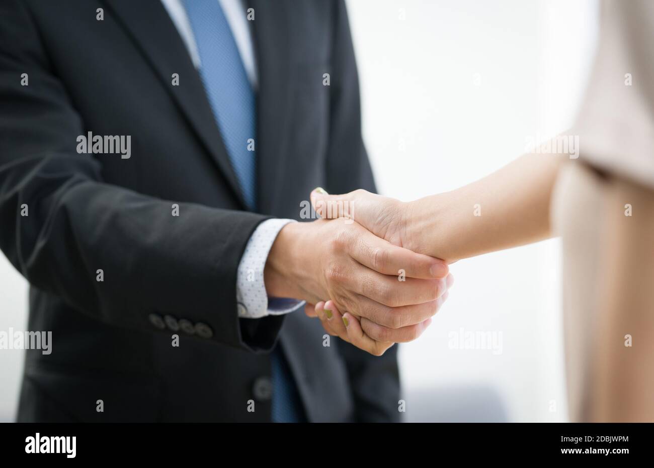 Business partners shaking hands in the modern office. Closeup Stock ...