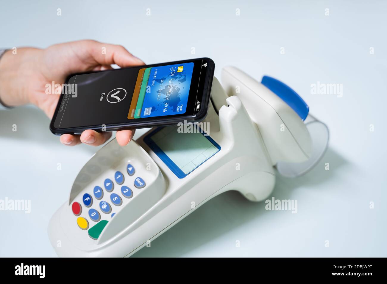 Paying With Mobile Phone To Cashier Using NFC Technology Stock Photo ...
