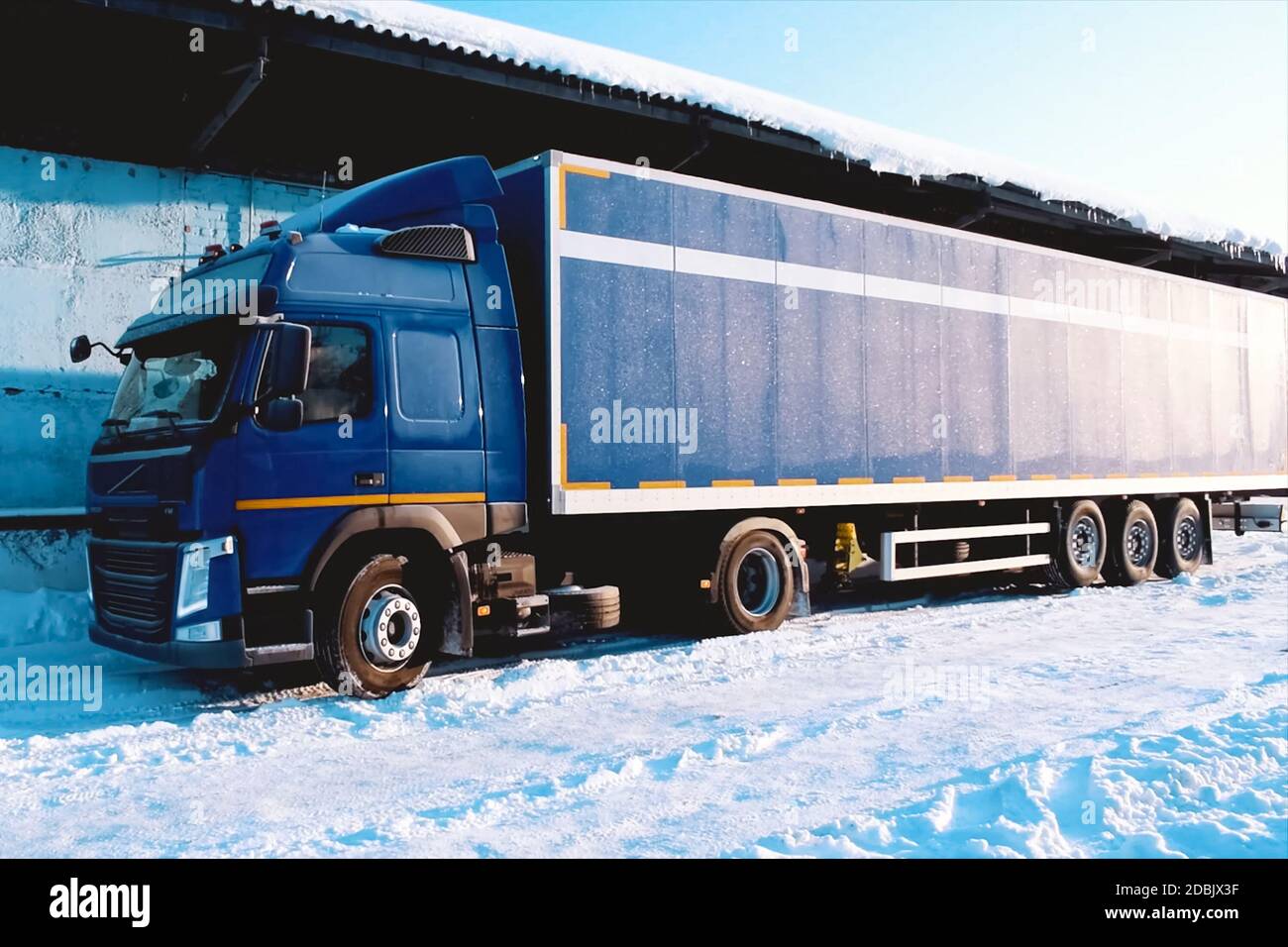 A large lorry with a trailer wagon. Cargo transportation in a container ...