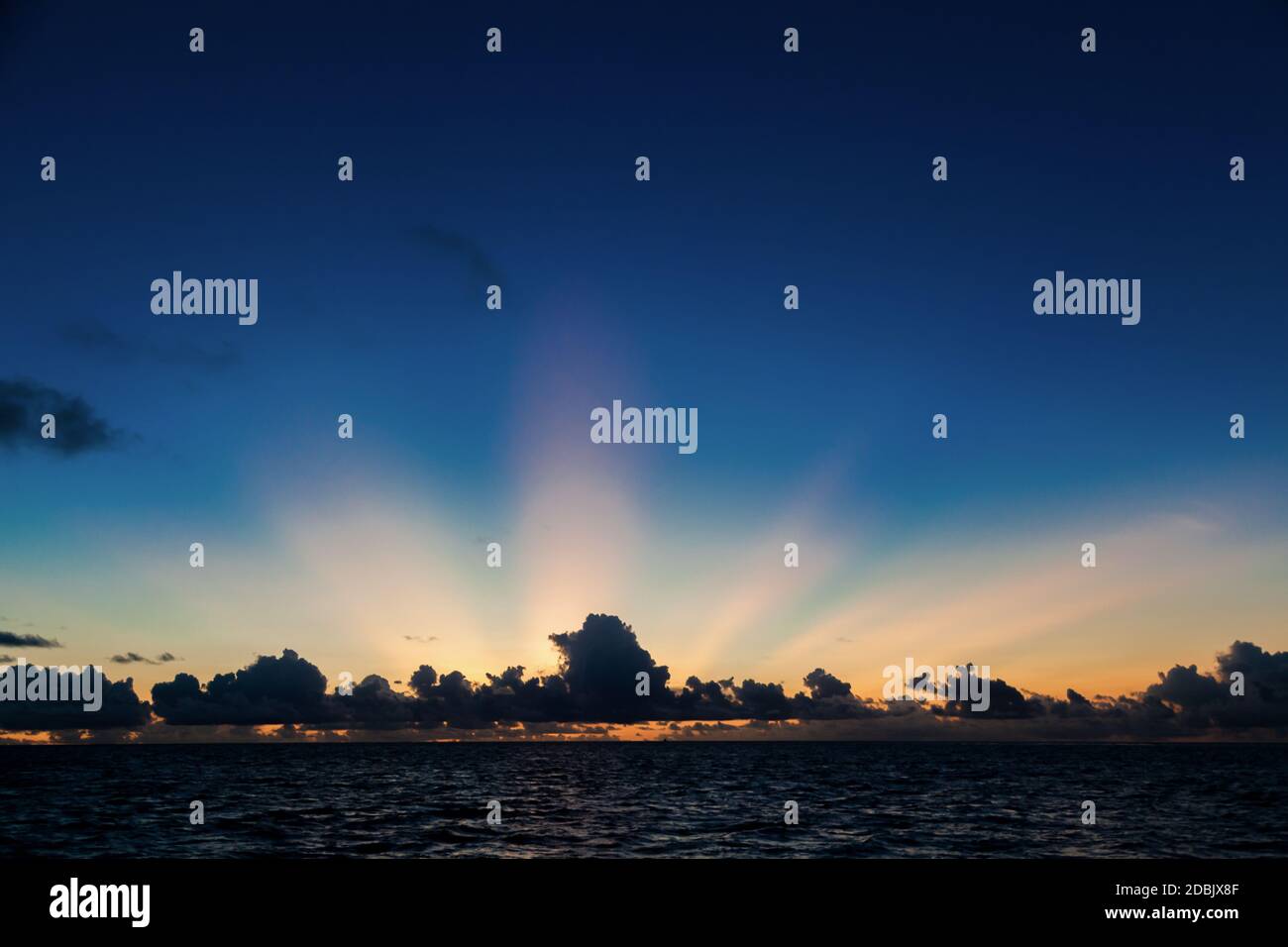 Sunset on an island Stock Photo - Alamy