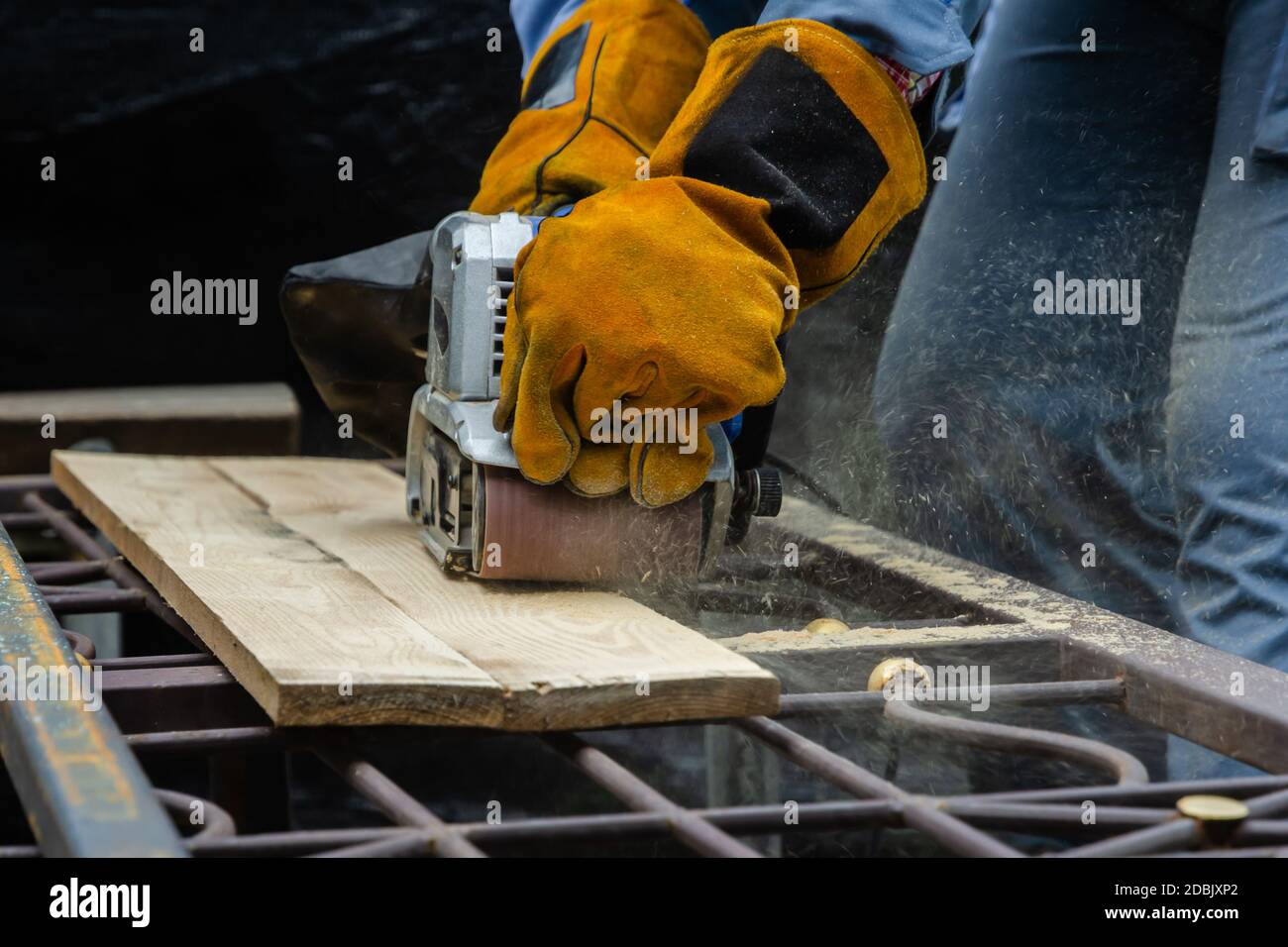 Wood sanding process by using handheld electric belt sander Stock Photo ...