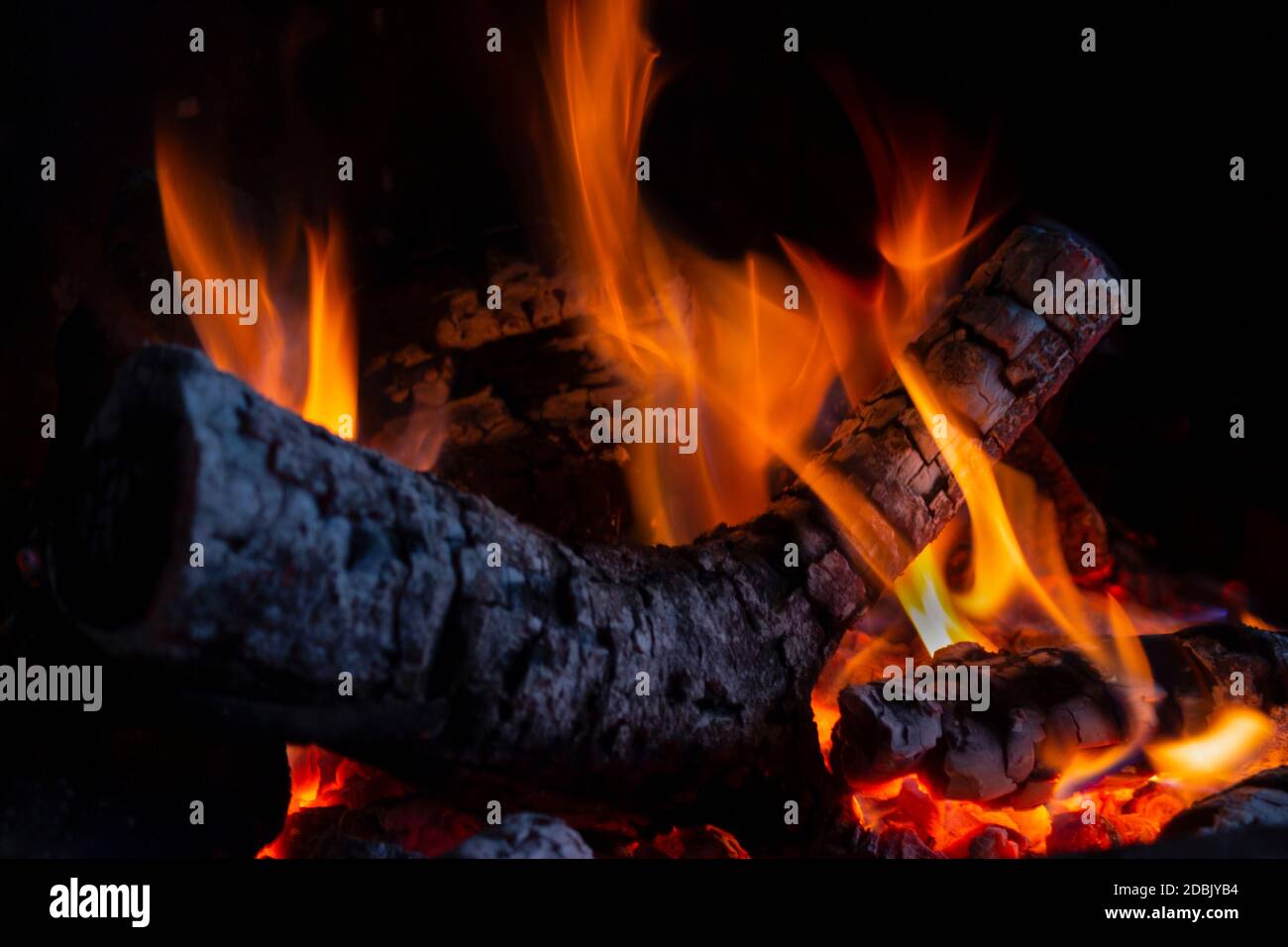 Wood burning in barbecue or fireplace closeup view Stock Photo - Alamy