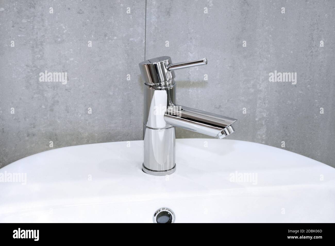Modern and simple water pipe chrome faucet Stock Photo - Alamy