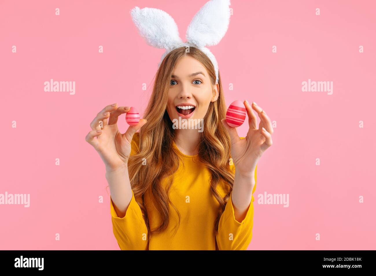 The concept of a happy Easter. Happy, surprised, shocked girl with ...