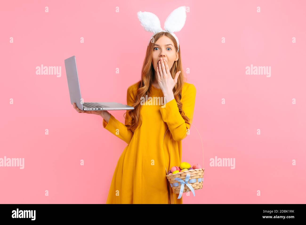 happy Easter. A shocked young woman in the ears of an Easter Bunny ...