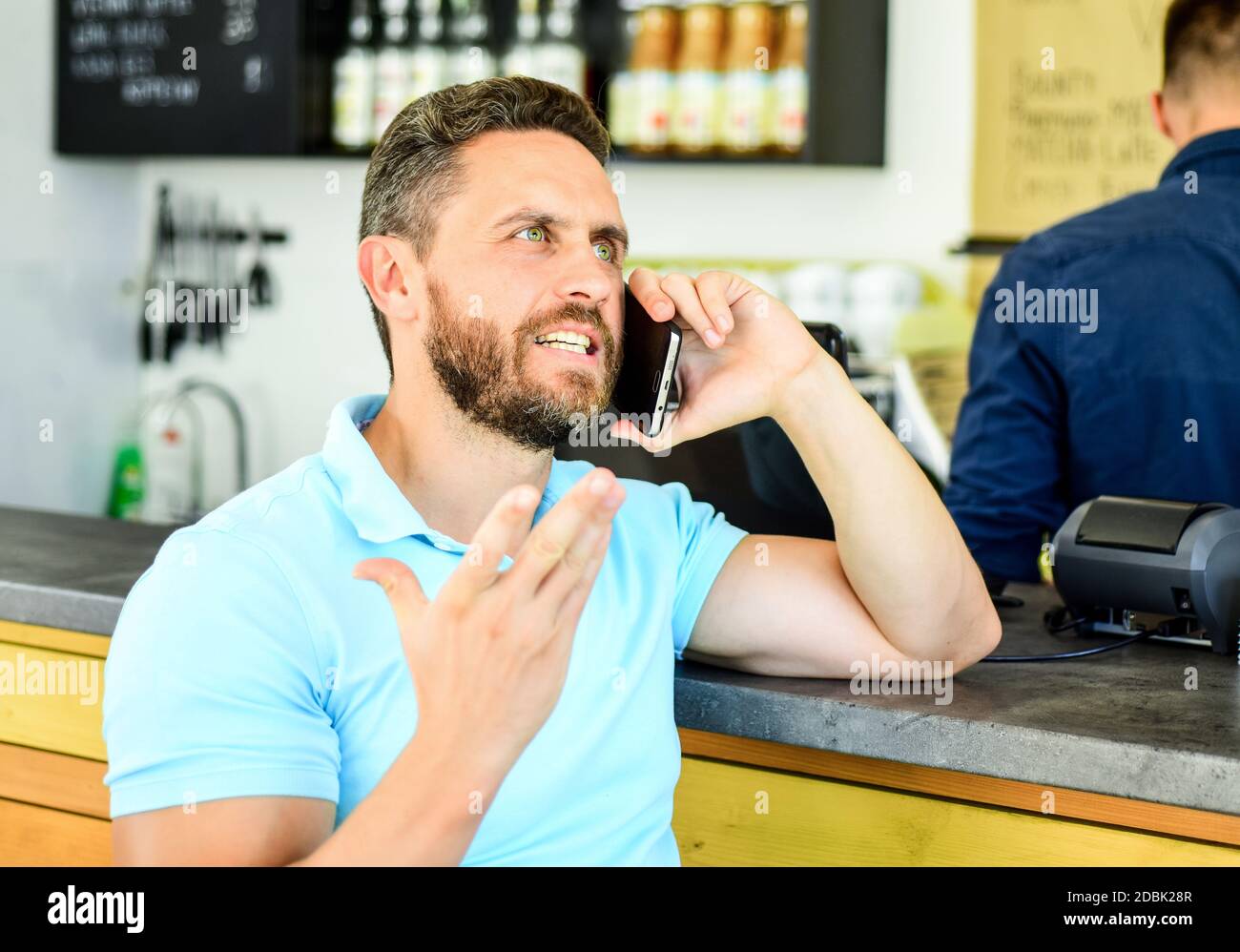 Waiting for you. Man mobile conversation cafe barista background. Drink ...