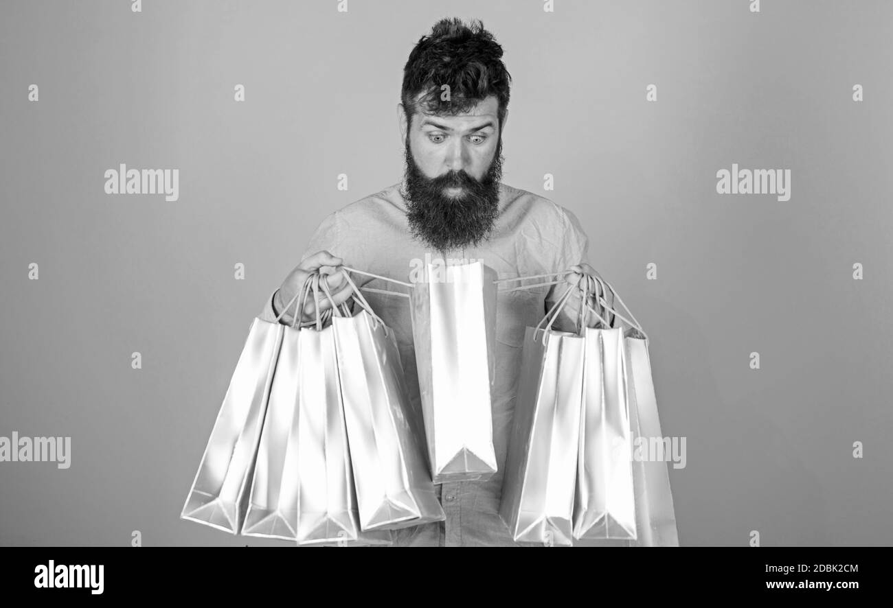 Sale and discount concept. Hipster on shocked face shopping addicted or ...