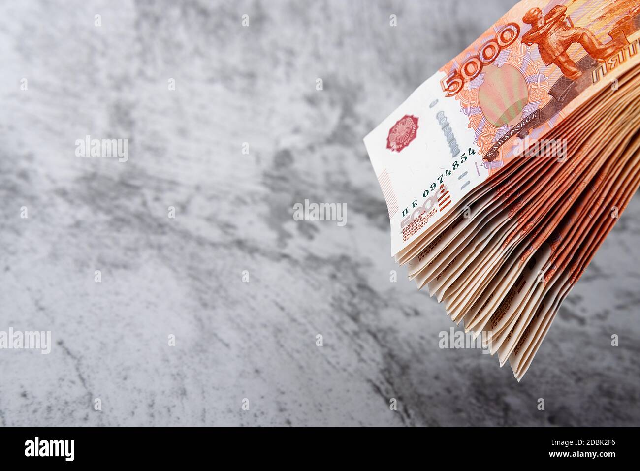 Russian cash banknotes of five thousand rubles, the bundle hangs on a ...