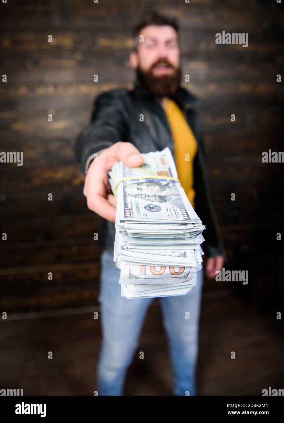 Man brutal bearded hipster wear leather jacket and hold cash money ...