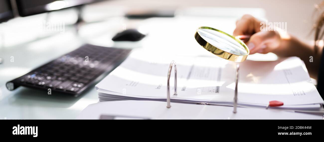 Auditor Investigating Corporate Fraud Using Magnifying Glass Stock ...