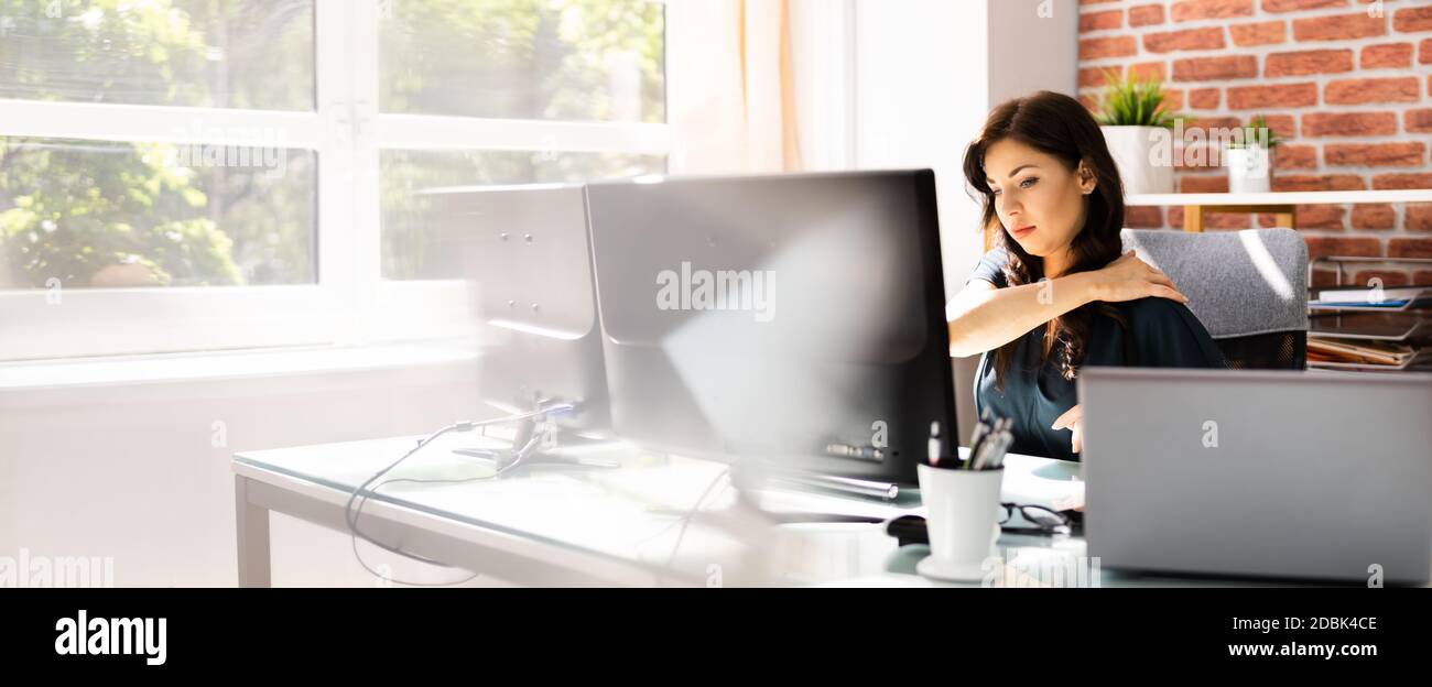 Neck Pain While Working At Computer. Bad Posture Stress Stock Photo - Alamy