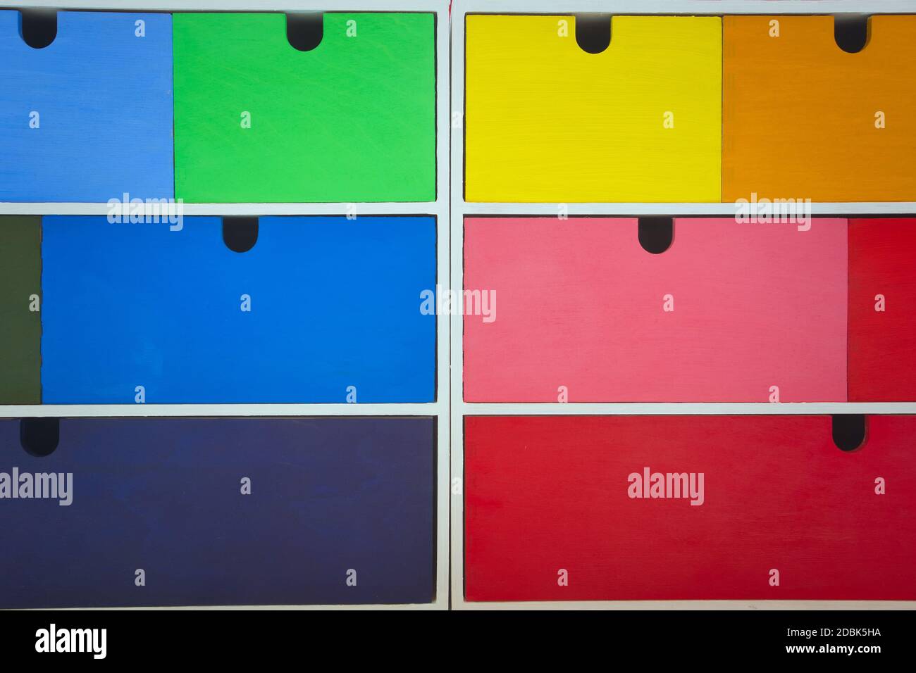 colorful wooden drawers in various colors, modern interior background ...