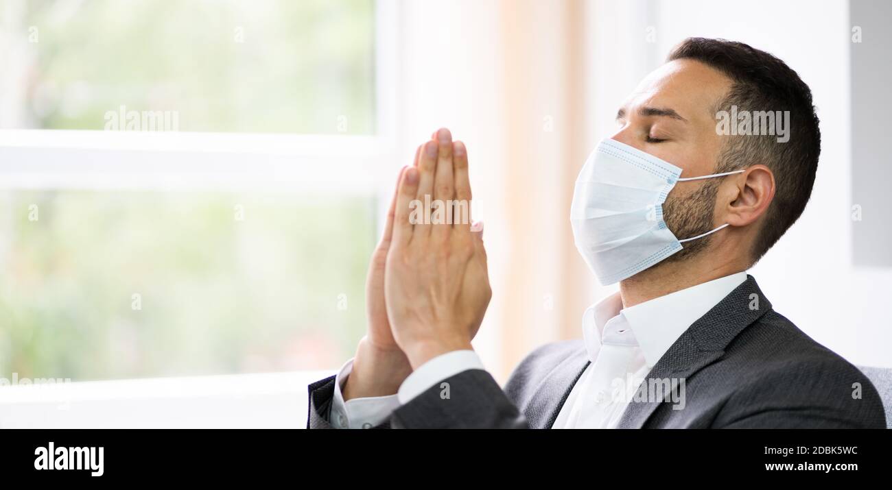 Man Prayer Worshiping Seeking God In Face Mask Stock Photo - Alamy