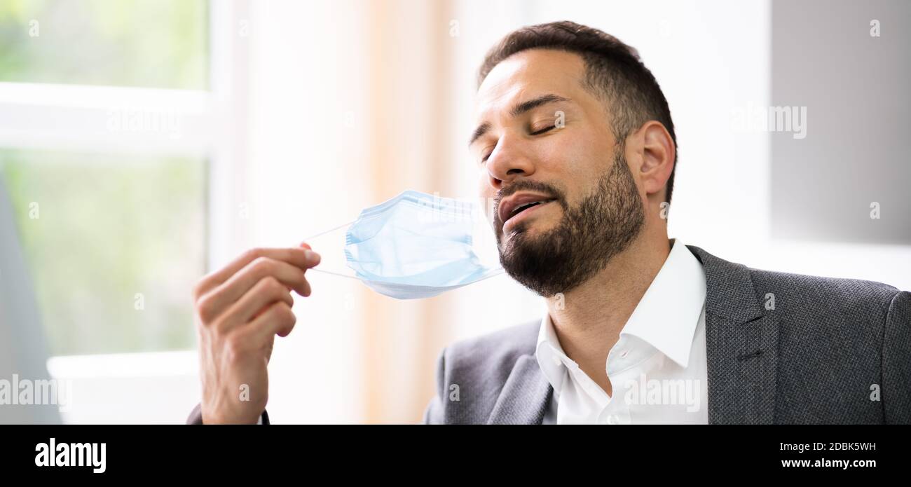 Man removing mask hi-res stock photography and images - Alamy